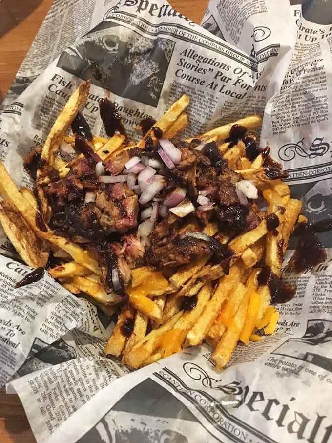 Loaded fries topped with meat and drizzled sauce transform a simple side into a full-blown meal.