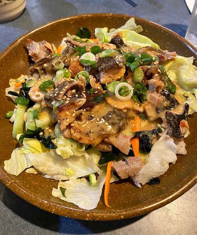 The Salmon Skin Salad proves that even the appetizers here don't believe in holding back or playing small.