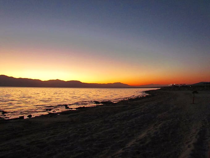 Sunset transforms this strange sea into pure magic, painting the sky in colors that would make Bob Ross weep.