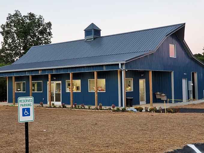 The barn-style concession building welcomes hungry patrons with that irresistible aroma of fresh popcorn and classic movie snacks.