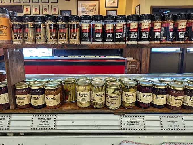 Shelves stocked with seasonings, sauces, and pickled treasures that transform good meat into unforgettable meals worth remembering.