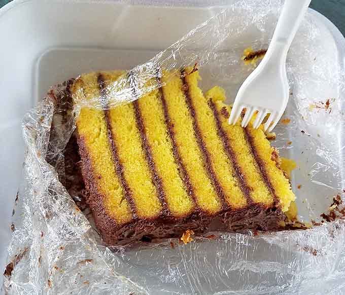 Layers of cake and chocolate that tower like delicious architecture, because you earned dessert after that meal.