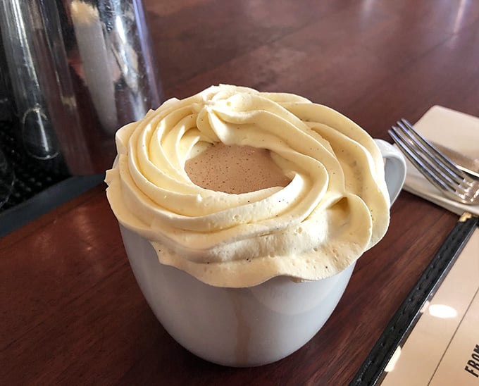Hot chocolate crowned with swirled whipped cream that's taller than some celebrity hairstyles from the 1980s.