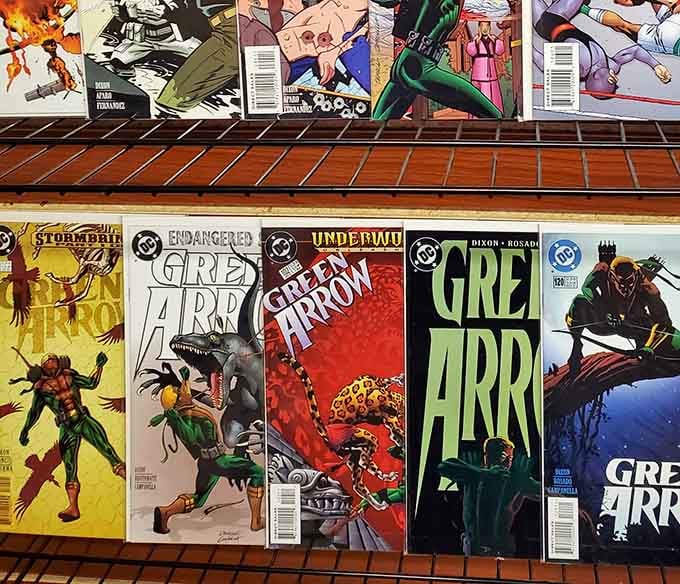 Green Arrow comics waiting patiently for the right collector to rescue them from their display case exile.