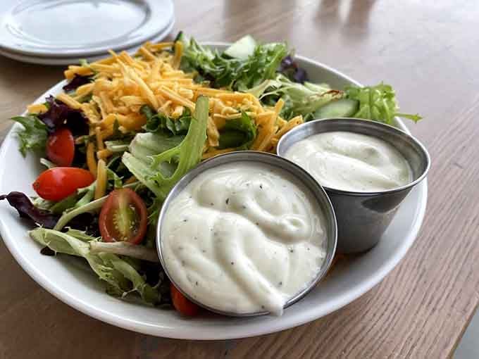Fresh greens topped with enough good stuff to make you forget you're technically eating something healthy and virtuous.