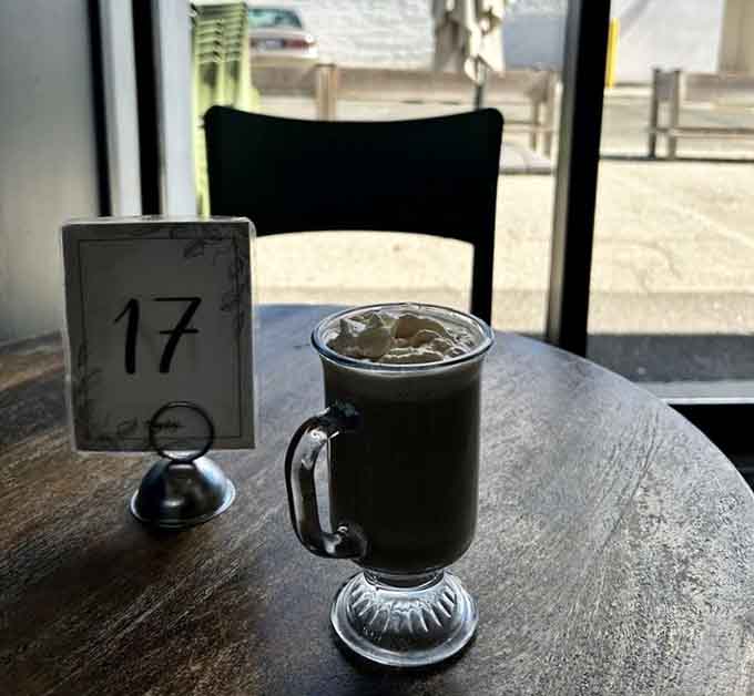 Hot chocolate served in proper glassware, because presentation matters even when you're basically drinking liquid dessert for lunch.