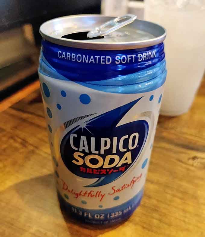 Calpico soda: the Japanese soft drink that tastes like someone turned a cloud into a beverage, delightfully refreshing.