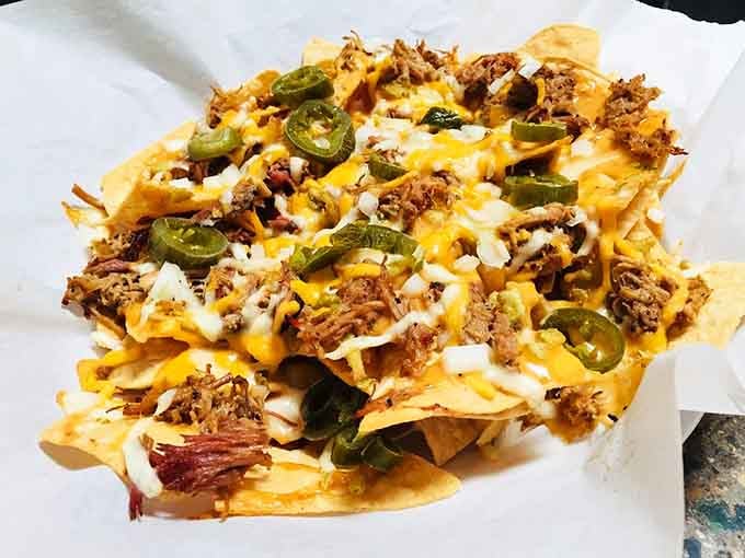 Nachos loaded with pulled pork and jalape&ntilde;os, because sometimes more really is more and that's beautiful.
