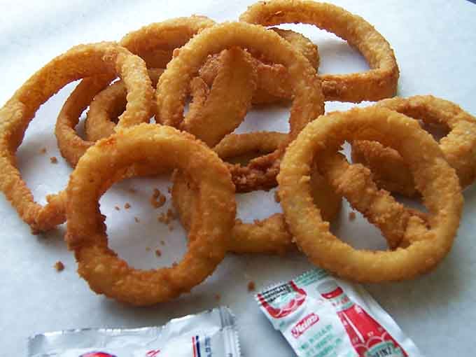Golden onion rings so crispy they practically sing when you bite into them, pure fried joy.