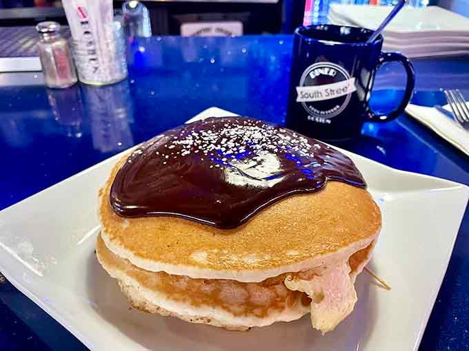 These fluffy pancakes drizzled with chocolate sauce are basically breakfast dessert, and nobody's complaining about that logic.