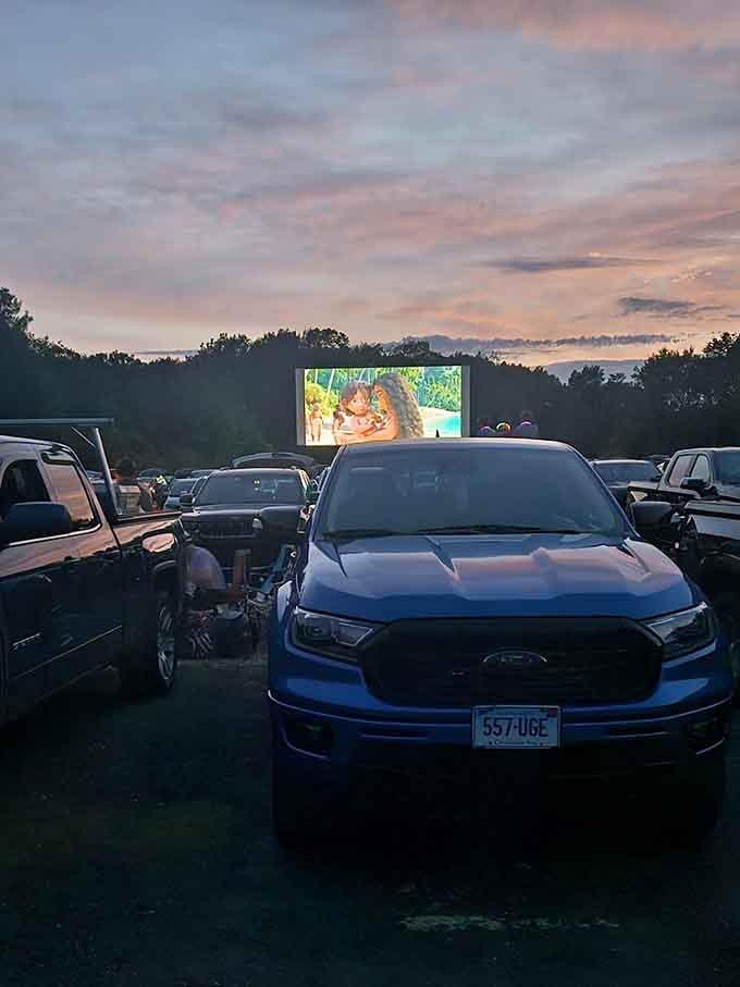 The glow of the screen against the evening sky creates a moment that no streaming service could ever hope to replicate.