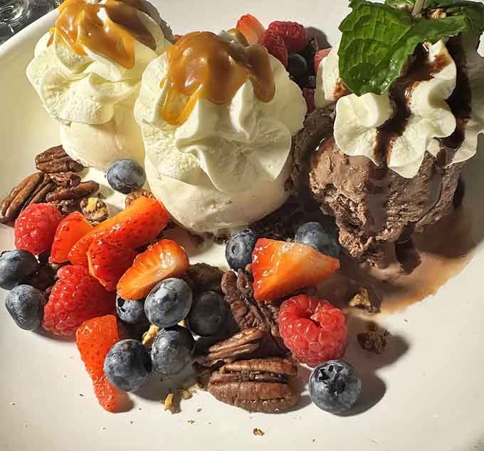 Chocolate brownie sundae topped with enough whipped cream to make your cardiologist schedule an intervention meeting.