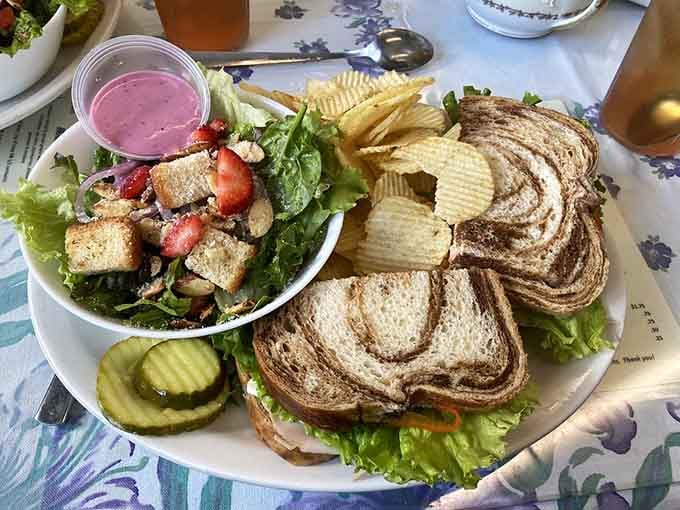 Turkey sandwich on marble bread with a side salad and chips - lunch done right without any corporate shortcuts.