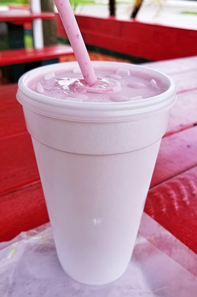 A strawberry milkshake so pink and perfect it looks like happiness decided to become a beverage.