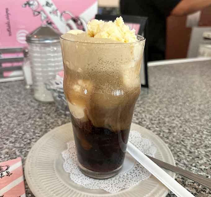 Root beer floats crowned with vanilla ice cream, fizzing and foaming like a science experiment you actually want to drink.