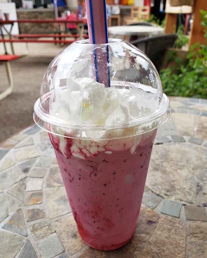 That strawberry shake topped with whipped cream is basically a liquid hug in a cup with a dome lid.