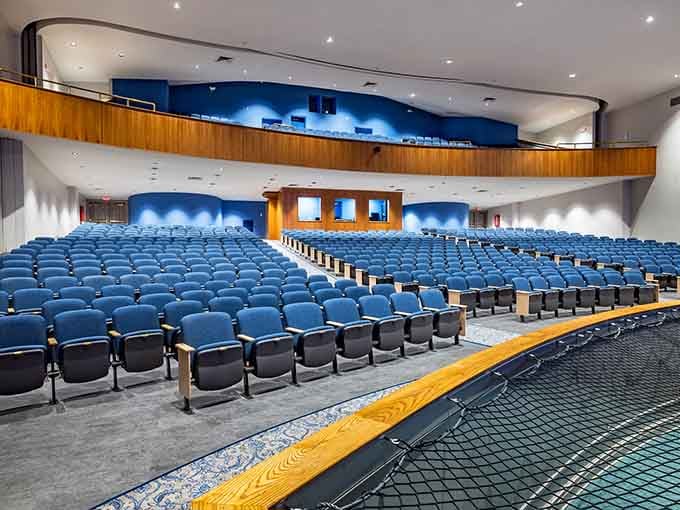 Blue seats await audiences in this impressive venue that brings performances to life with style and comfort.
