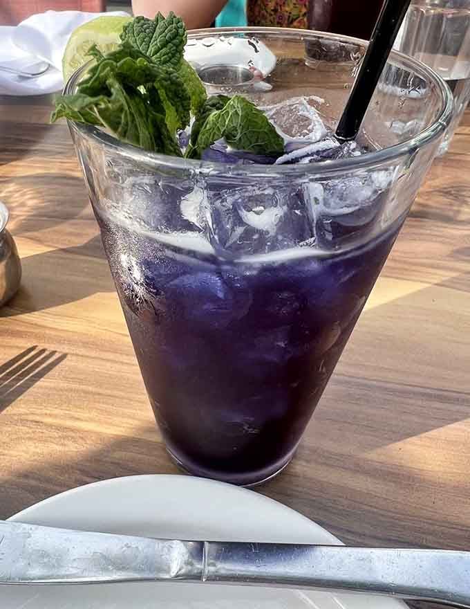 That vibrant purple drink with fresh mint looks like something a wizard would order for breakfast refreshment.