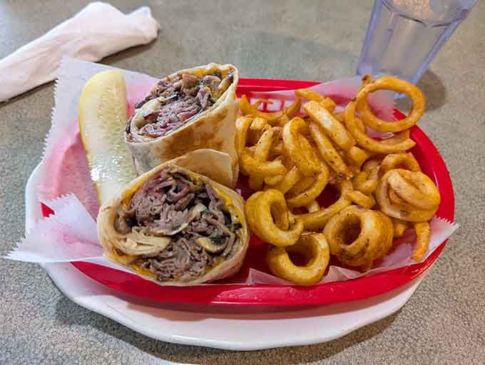 This burrito comes stuffed and wrapped tight, served with onion rings that could make a grown person weep.