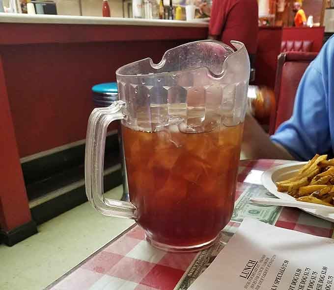 Sweet tea served in a proper pitcher means refills are coming, and your Southern hydration needs are covered.