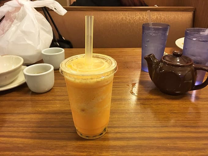 Frozen mango bubble tea: the perfect companion for intense gaming sessions or just pretending you're being productive.