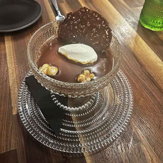 Dessert arrives looking like edible art, proving that sweet endings are just as important as strong beginnings in this world.