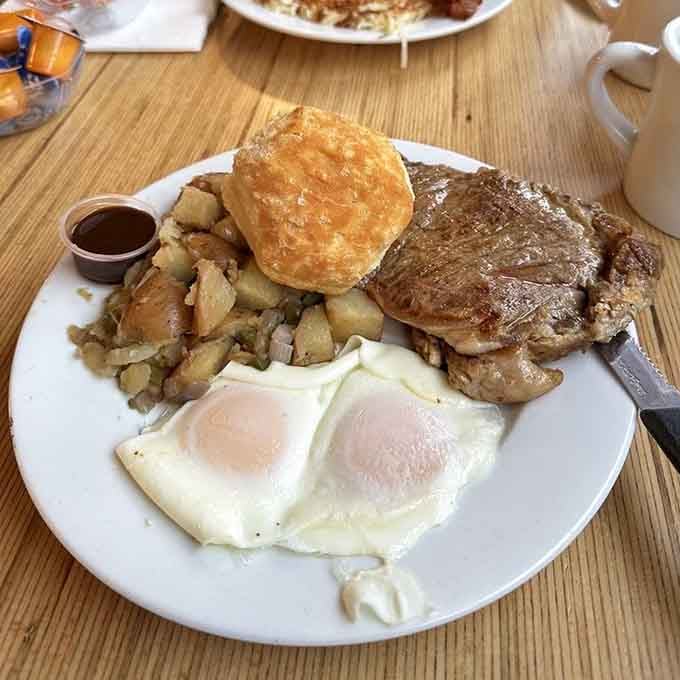 That country fried steak with eggs and potatoes is basically a Southern hug on a plate, complete with biscuit.
