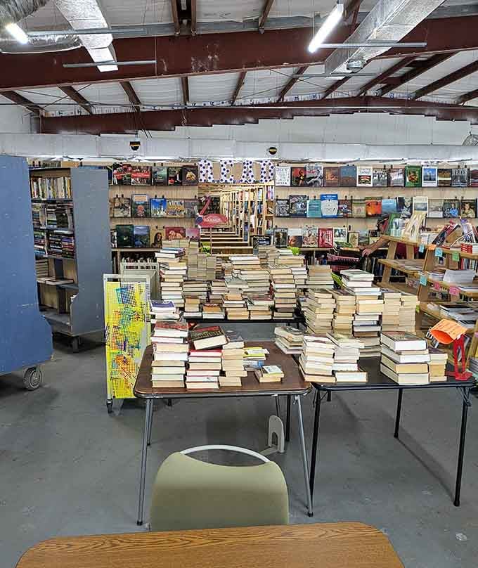 Mountains of books await sorting like literary Everest, proving that ten tons weekly isn't just marketing hyperbole.