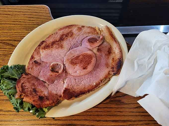 That ham steak didn't come from a laboratory—it's thick, juicy, and tastes like actual pork from an actual pig.