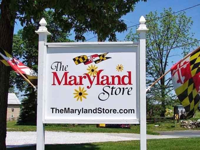 The Maryland Store's sign proudly waves the state flag, promising authentic local flavor and unforgettable fried chicken within.