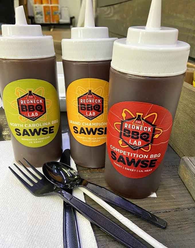 Three sauce options representing different barbecue philosophies, because choosing sides in sauce debates is half the fun.