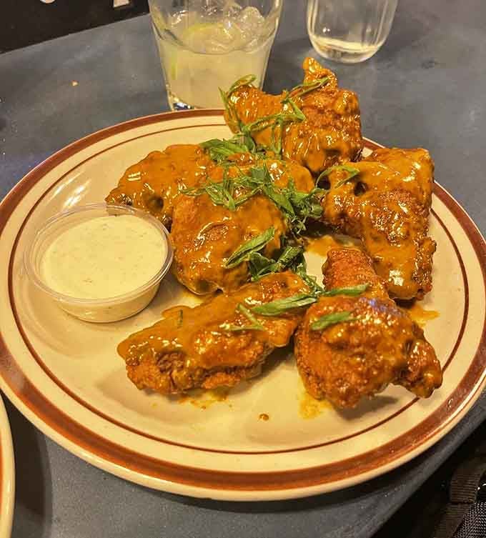 Golden, saucy, and glistening with promise, these wings are what chicken dreams of becoming when it grows up.