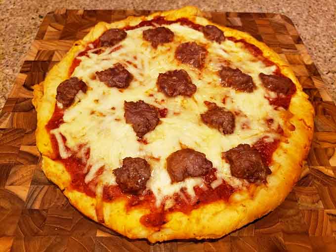 Homemade pizza that looks like someone's nonna made it with love, mozzarella, and absolutely no concept of portion control.