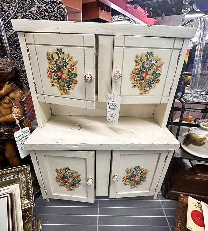 This miniature cabinet with floral details is cottage-core perfection, ready to organize your trinkets with vintage charm.