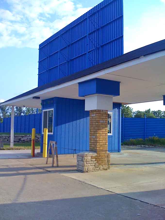 Pull up to this blue beacon of nostalgia where admission buys you freedom, popcorn, and two full features.