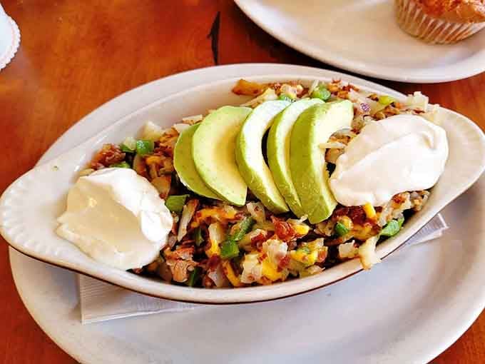The Potatoes Del Riego loaded with avocado, sour cream, and all the fixings is basically a fiesta on a plate.