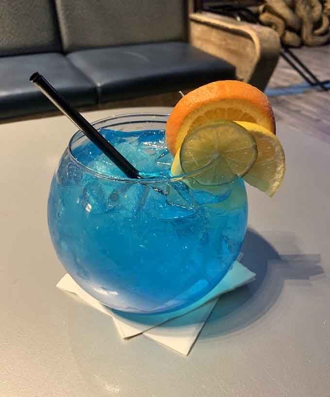 That electric blue cocktail screams "I'm here for a good time, not a long time" louder than any drink should.
