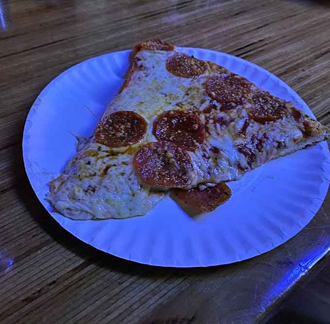 Pepperoni pizza by the slice, because sometimes the classics don't need improvement, just proximity to Pac-Man and cold beer.