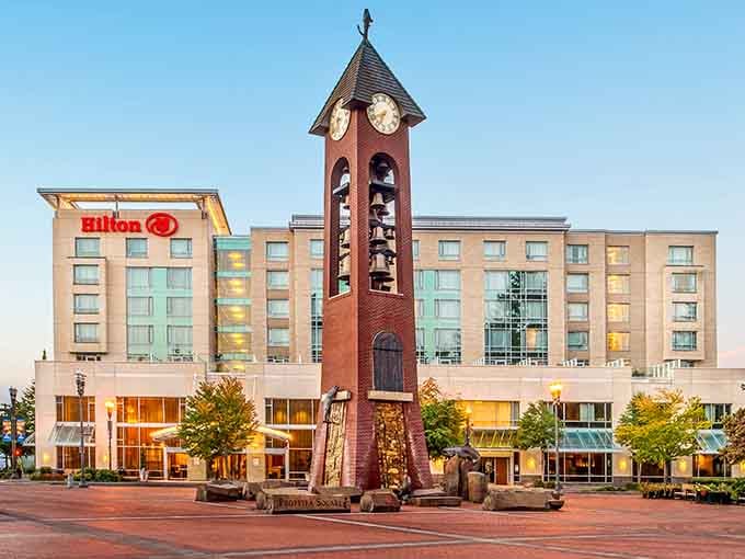 The Hilton anchors downtown with its distinctive clock tower, serving as Vancouver's answer to Big Ben, just more Pacific Northwest.
