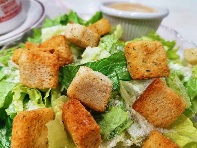 Crispy croutons dotting fresh greens prove that even salads get the royal treatment at a proper diner.