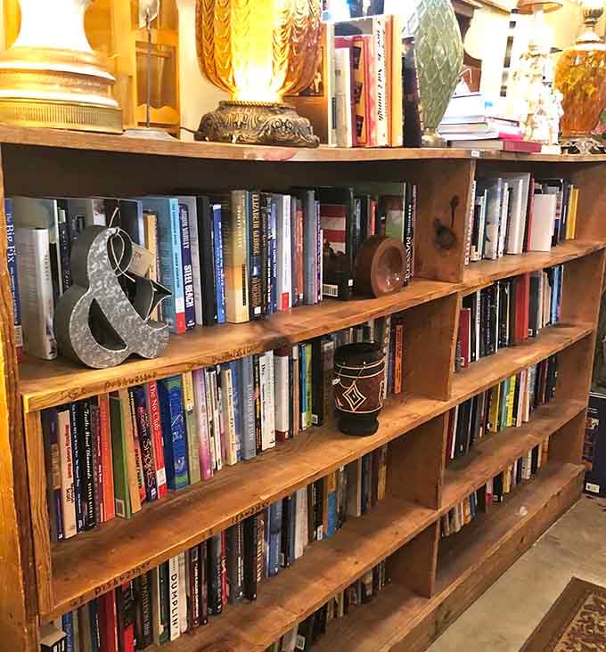 That metal ampersand knows it's the star of this bookshelf, surrounded by reads spanning every interest.