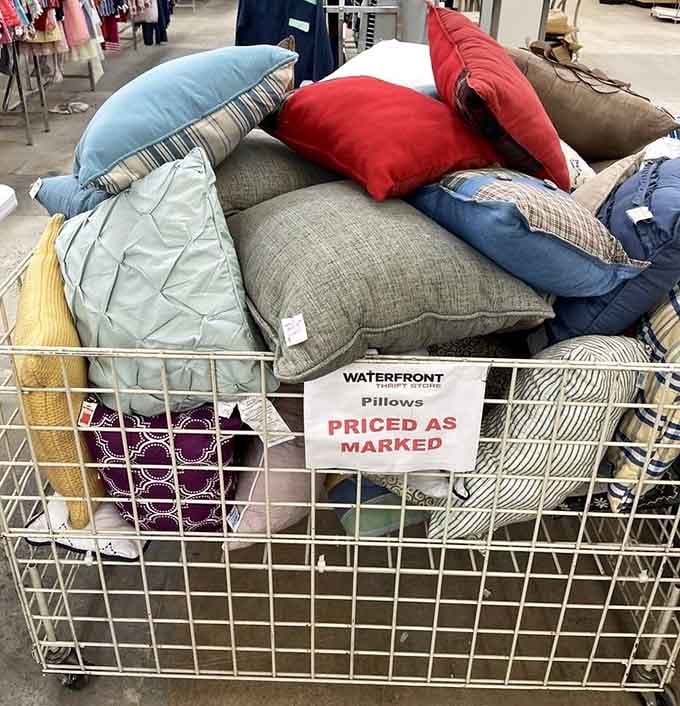Colorful pillows piled high in a cart, ready to refresh any room for pocket change instead of a fortune.