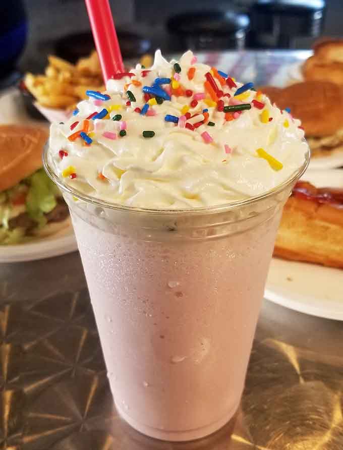 Topped with whipped cream and sprinkles, this shake is thick enough to require commitment and arm strength.