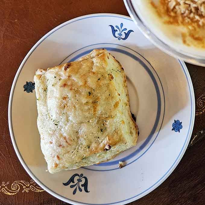 Golden, flaky, and flecked with herbs, this savory treat proves carbs are always worth the calories.