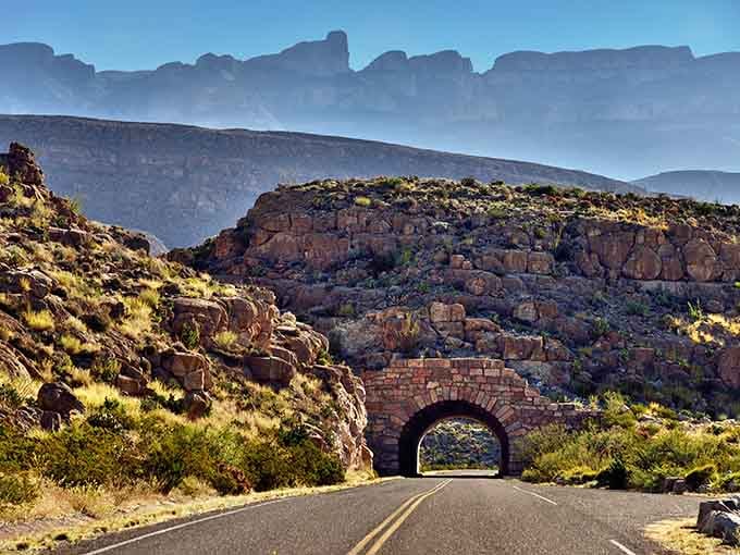 That stone tunnel carved through solid rock transforms an ordinary drive into an unforgettable adventure through time.