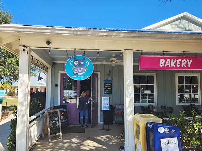 Colorful signs and cottage charm invite you to discover fresh-baked treats in this delightful beachside bakery hideaway.