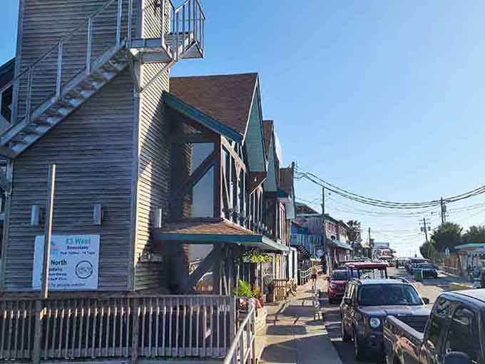 Weathered wooden buildings stacked like a coastal layer cake, where every balcony tells a salty story.