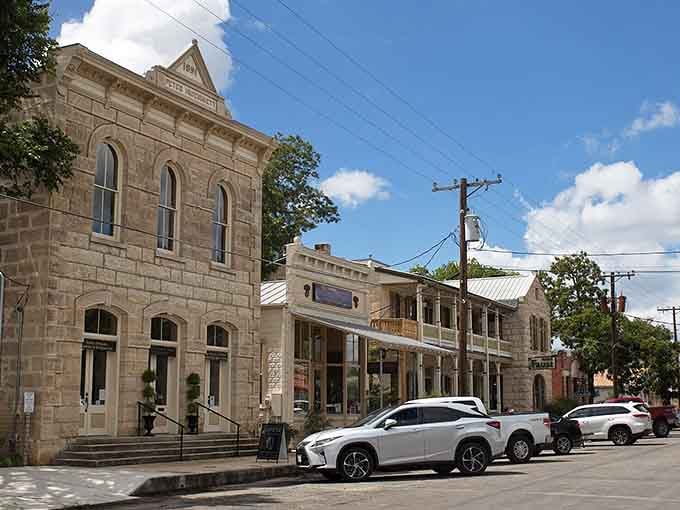 That solid limestone building with its arched windows has weathered more than a century of Texas summers without breaking a sweat.