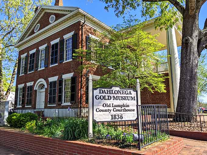 Spring greenery frames this handsome 1836 courthouse where America's first major gold rush began its glittering story.