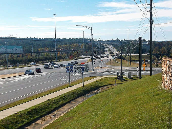 This wide intersection serves up a buffet of highways under a bright, fluffy sky.